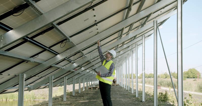 The Technician in Uniform Makes Notes in the Notebook. Stock Footage ...
