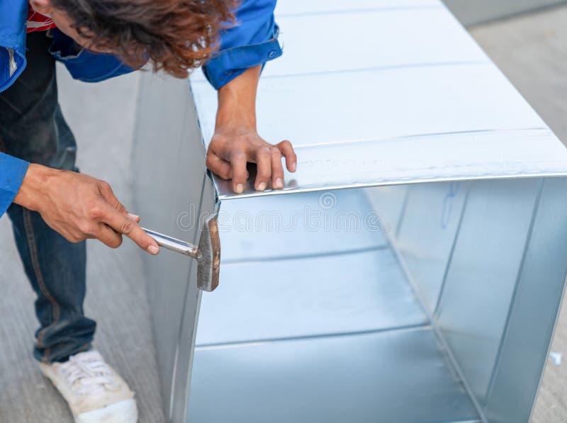 Technician Use Mallet Folding Edge of Metal Sheet for Make Square Hood ...