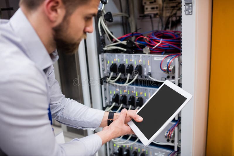 Technician Using Digital Tablet while Analyzing Server Stock Photo ...