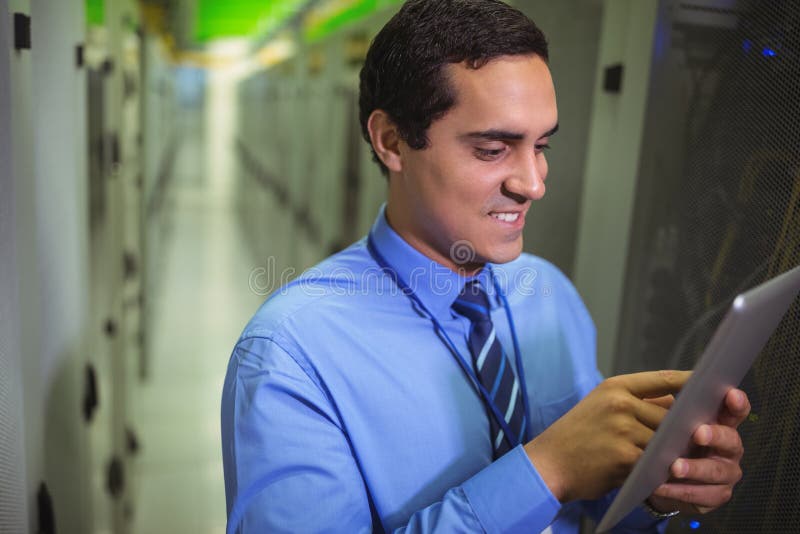 Technician Using Digital Tablet in Hallway Stock Image - Image of ...