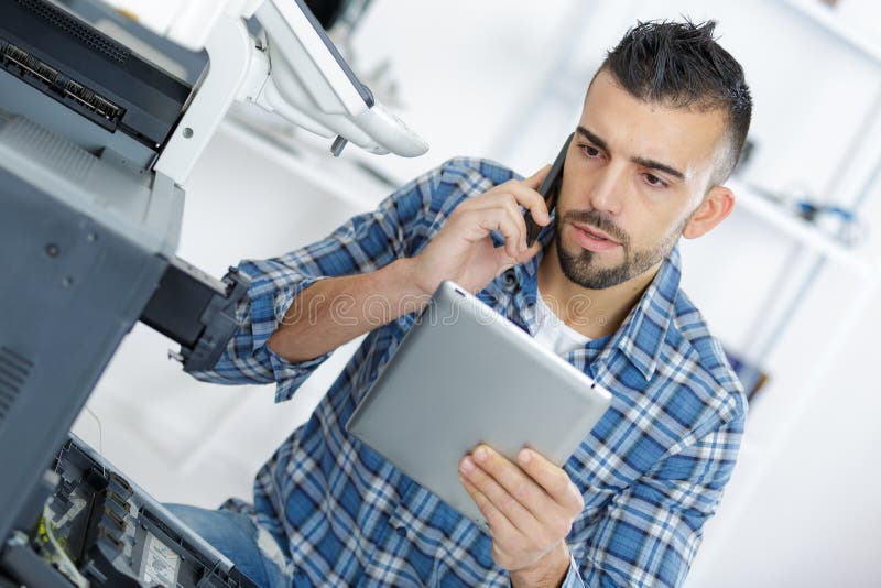 Technician Using Phone and Laptop Tablet Stock Image - Image of server ...