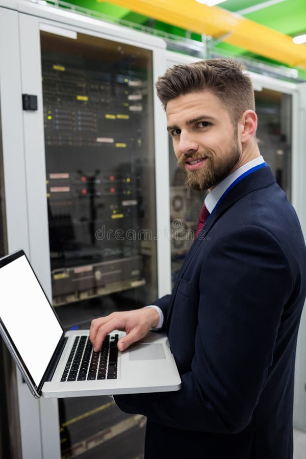 Technician Using Laptop while Analyzing Server Stock Image - Image of ...