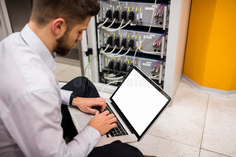 Technician Using Laptop while Analyzing Server Stock Photo - Image of ...