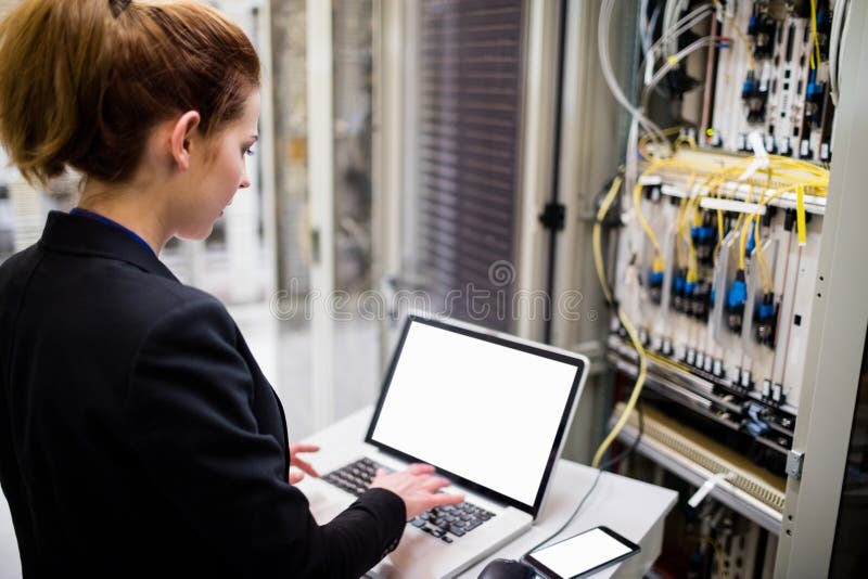 Technician Using Laptop while Analyzing Server Stock Photo - Image of ...