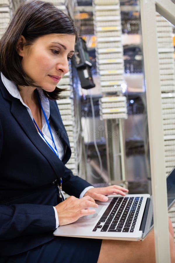 Technician using on laptop stock photo. Image of maintenance - 78696978
