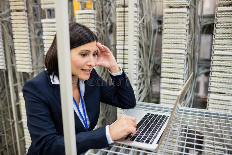 Technician using laptop stock image. Image of engineering - 78696117
