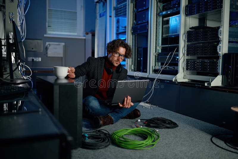 It Technician Using Laptop while Working in Data Center Stock Image ...