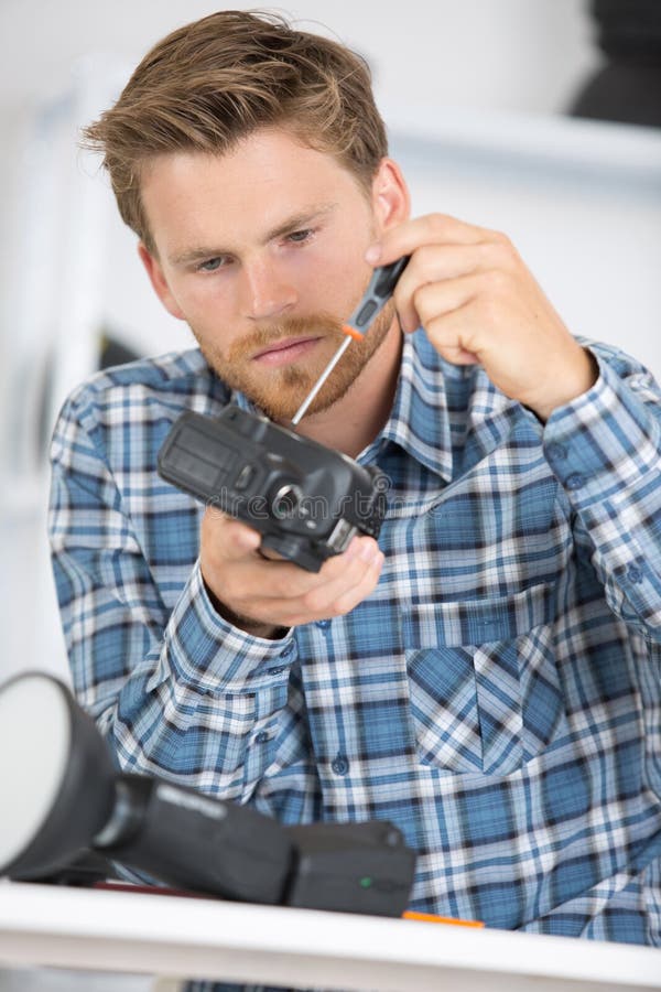 Technician Using Screwdriver on Camera Stock Image - Image of beard ...