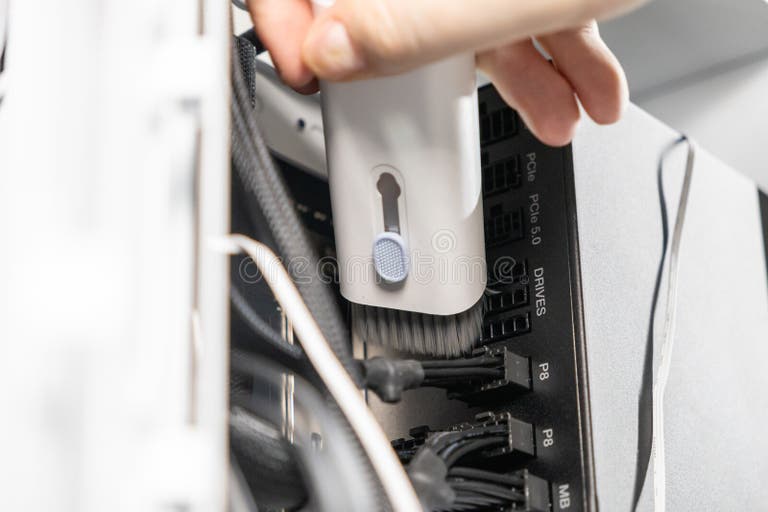 Technician Using Soft Brush To Clean Modular PSU Ports and Cables ...
