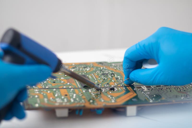 Technician Using a Soldering Iron To Repair a Circuit Board Stock Image ...