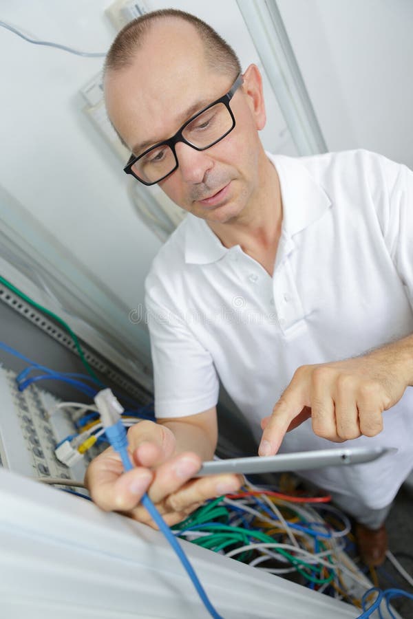 Technician Using Tablet while Analysing Server Stock Photo - Image of ...