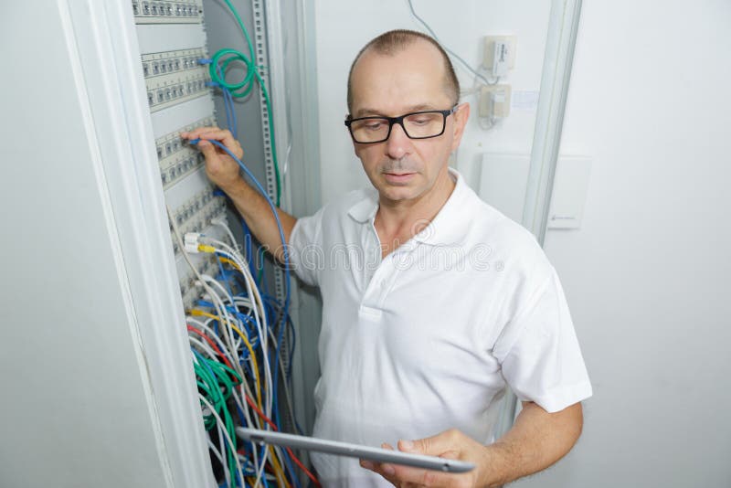 Technician Using Tablet in Server Room at Data Centre Stock Image ...