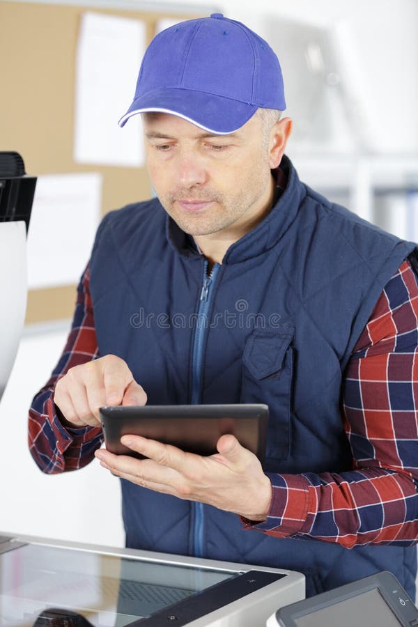 Technician Using Tablet To Fix Printer Stock Image - Image of printer ...