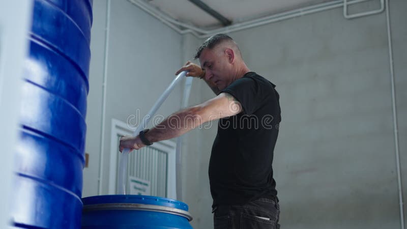 A Barrel in a Warehouse is on Fire with Bright Flames and Thick Black ...