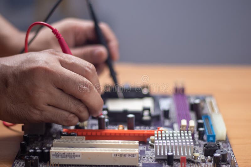 Technician Using a Soldering Iron To Repair a Circuit Board Stock Photo ...