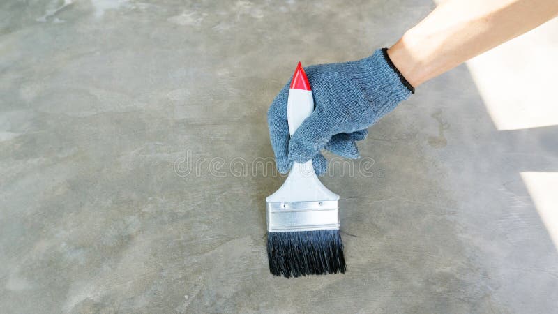 Technician Using a Varnish Paint with a Cement Floor Stock Photo ...