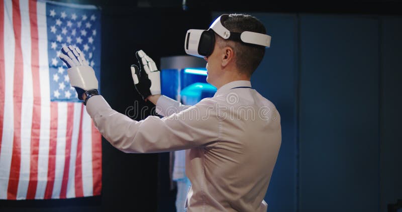 Technician Using VR Headset and Exoskeleton Gloves Stock Photo - Image ...