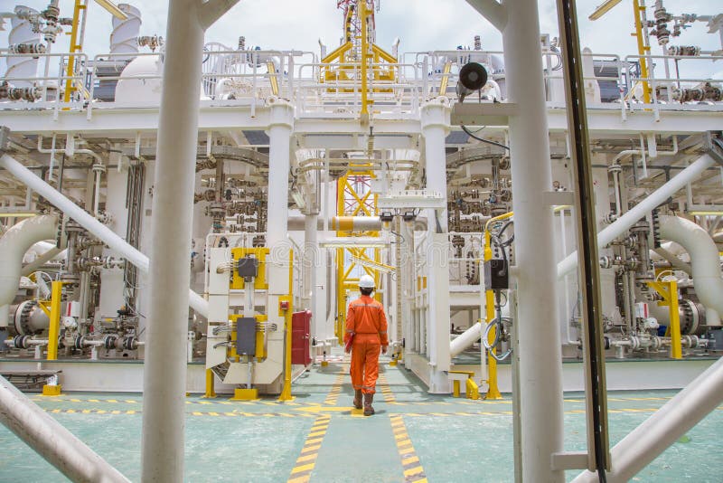 Technician Walking through Offshore Oil and Gas Process for Checking ...
