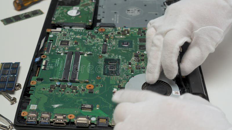 Laptop Motherboard Repair Process in a Well-lit Workspace Stock Video ...
