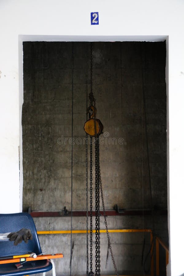 Technician Welding To Maintain Lift in Factory Stock Photo - Image of ...