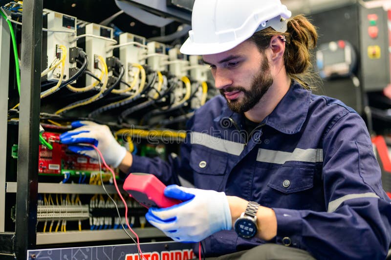 Technician with White Helmet Checking and Repairing Part Stock Photo ...