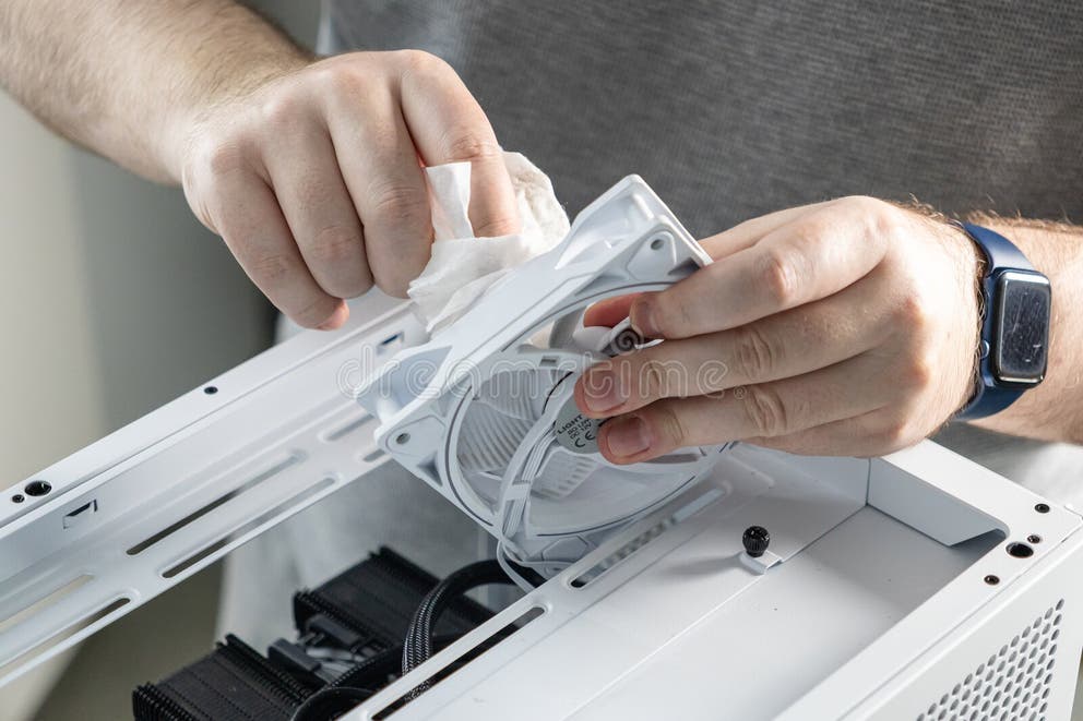 Technician Wiping Dust from White Computer Cooling Fan Removed from Top ...