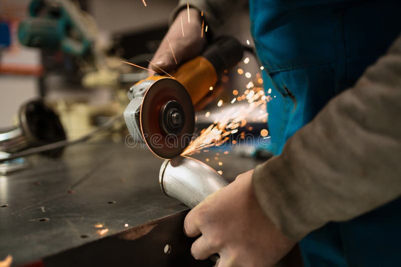 Worker Working with a Circular Grinder on a Metal with Sparks Stock ...