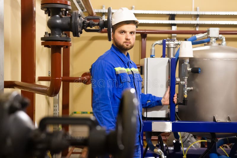 Technician in Oil and Gas Refinery. Worker in Oil Refinery Stock Image ... Technician in Oil and Gas Refinery. Worker in Oil Refinery Stock Image ...