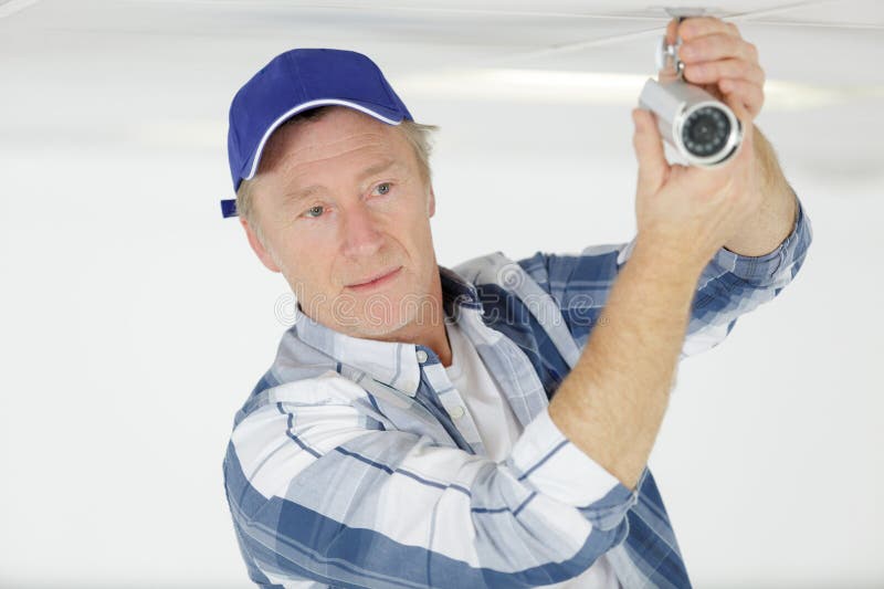 Technician Worker Installing Video Surveillance Camera on Wall Stock ...