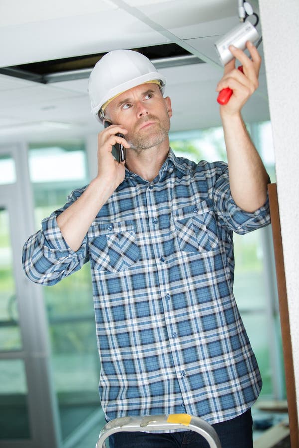 Technician Worker Installing Video Surveillance Camera on Wall Stock ...