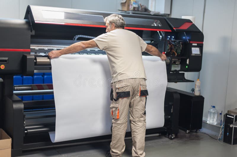 Technician Operator Works on Large Premium Industrial Printer Plotter ...
