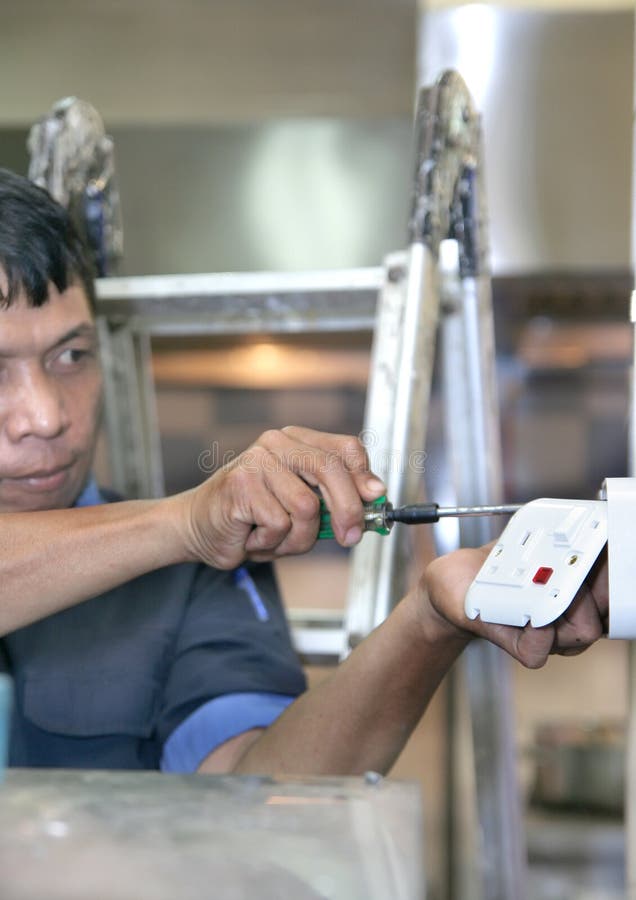 Technician fixing machine stock image. Image of fixing - 6410723