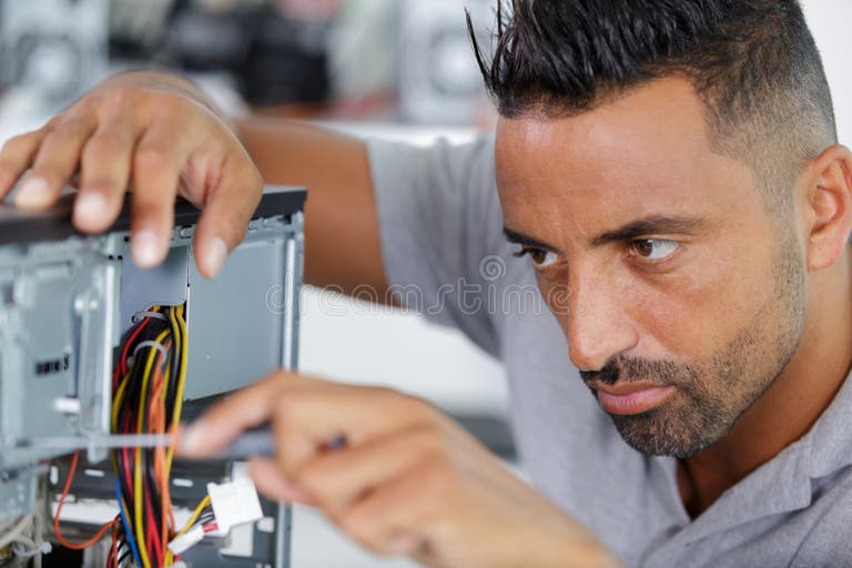 Technician Working on Broken Computer in Workshop Stock Image - Image ...