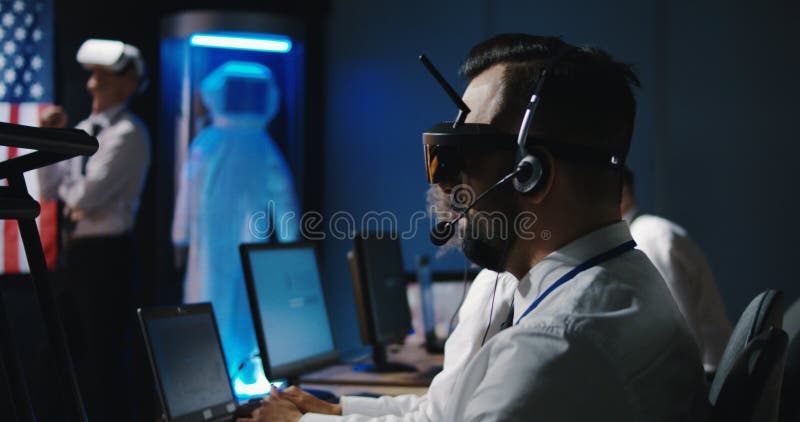Technician Working at His Desk Stock Image - Image of headphones ...