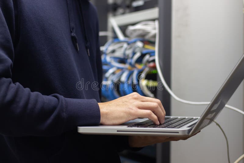 Technician Working on Laptop in Server Room Stock Image - Image of ...