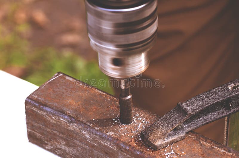Working with Metal. Men S Hands with a Drill Stock Image - Image of ...