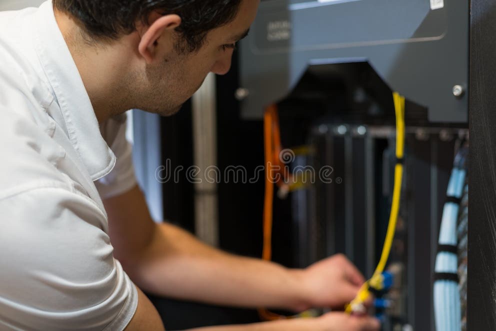 It Technician Working on Network Servers and Cable Stock Photo - Image ...