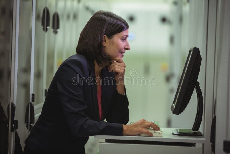 Technician Working on Personal Computer while Analyzing Server Stock ...