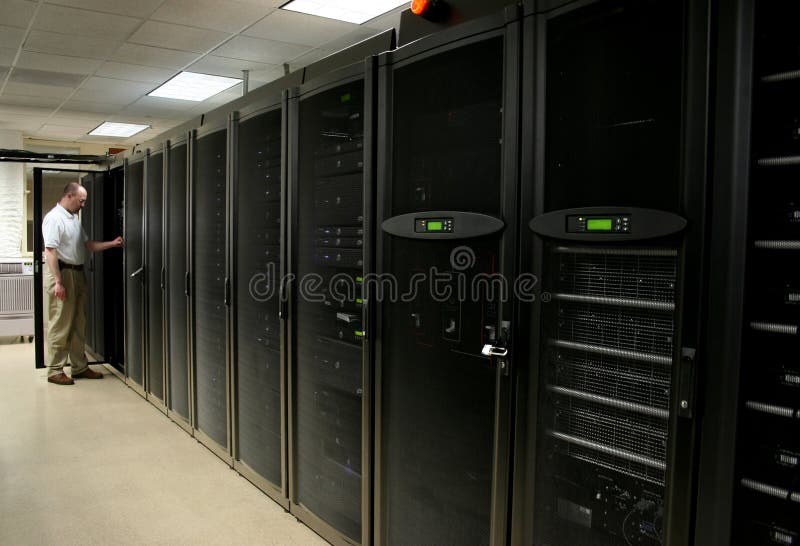Technician Working in a Server Room Stock Photo - Image of drive, nerd ... Technician Working in a Server Room Stock Photo - Image of drive, nerd ...