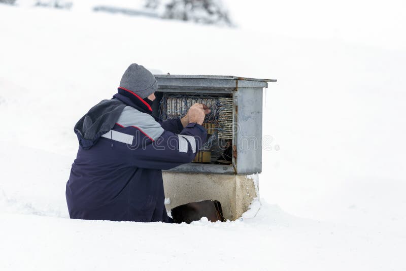 Technician Working in the Snow Stock Photo - Image of lines, digital ...
