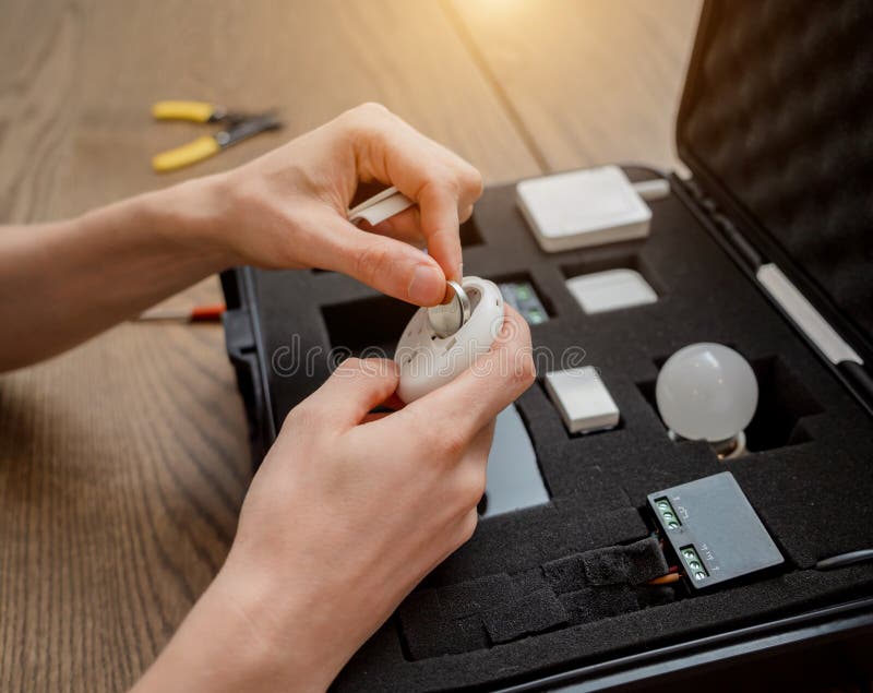 A Technician Works with a Demo Kit of the Smart Home System Stock Image ...