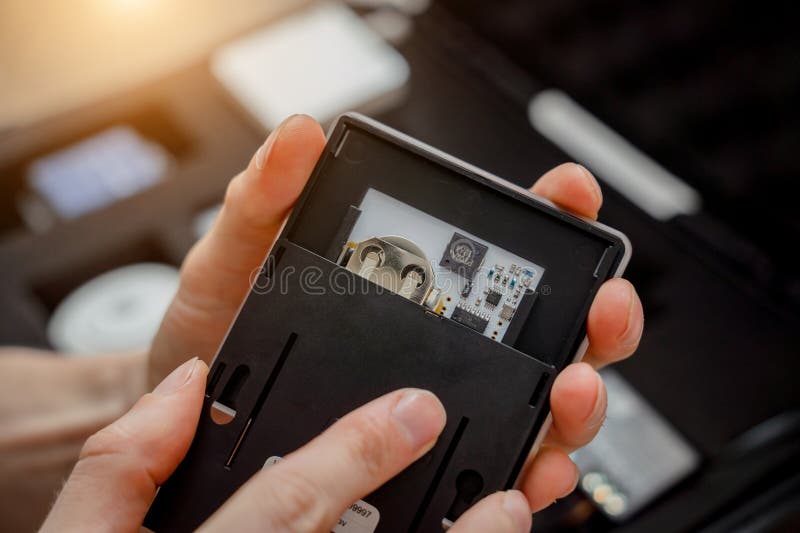 A Technician Works with a Demo Kit of the Smart Home System Stock Image ...