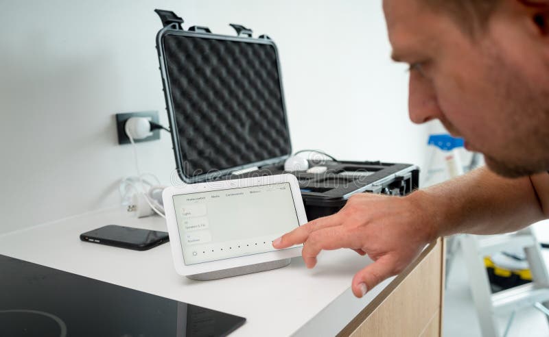 A Technician Works with a Demo Kit of the Smart Home System Stock Photo ...