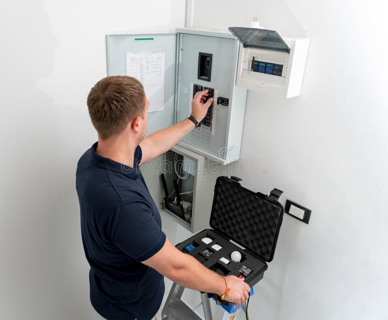 A Technician Works with a Demo Kit of the Smart Home System Stock Image ...