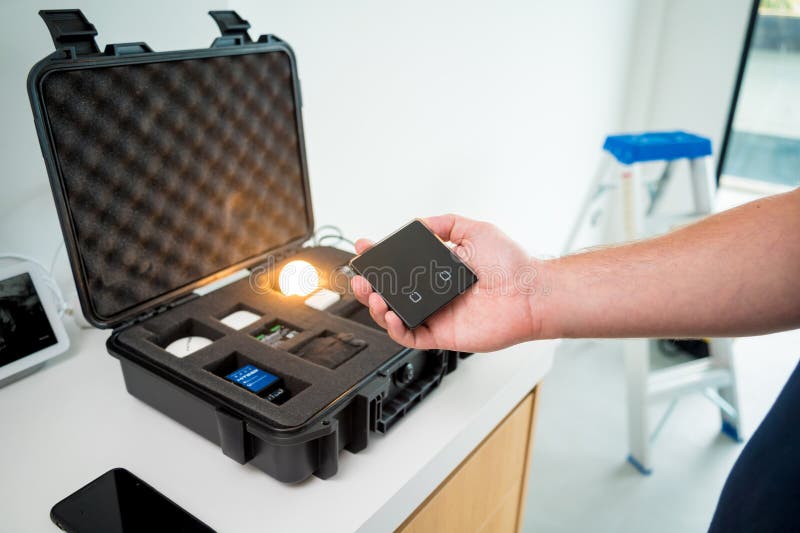 A Technician Works with a Demo Kit of the Smart Home System Stock Image ...