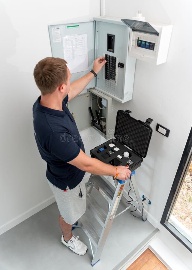 A Technician Works with a Demo Kit of the Smart Home System Stock Image ...