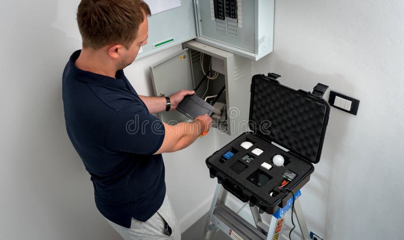 A Technician Works with a Demo Kit of the Smart Home System Stock Photo ...