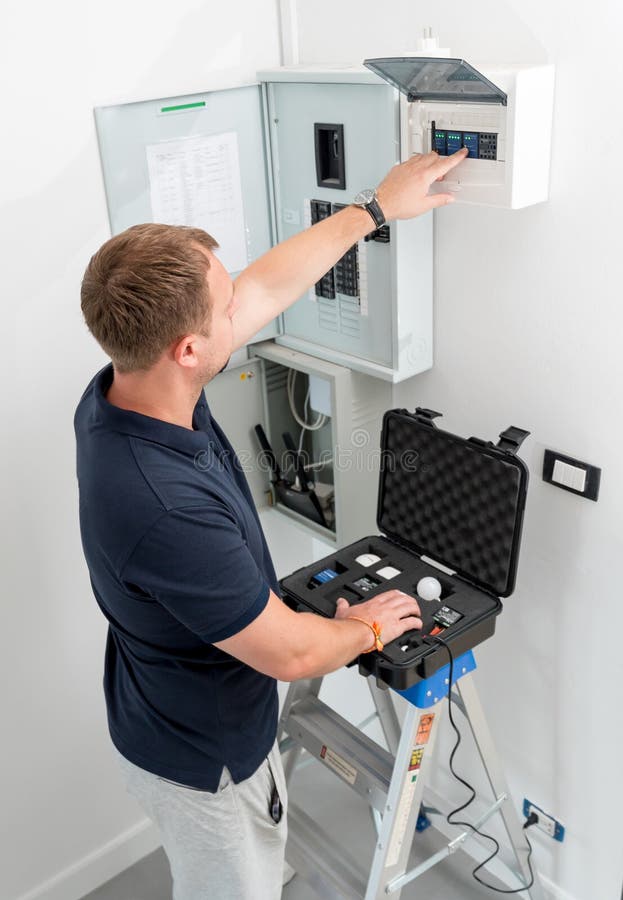 A Technician Works with a Demo Kit of the Smart Home System Stock Image ...