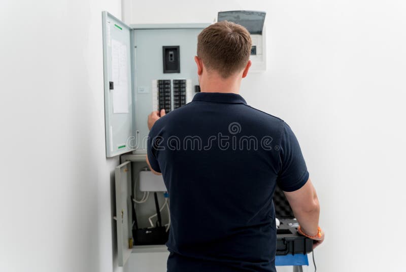 A Technician Works with a Demo Kit of the Smart Home System Stock Image ...
