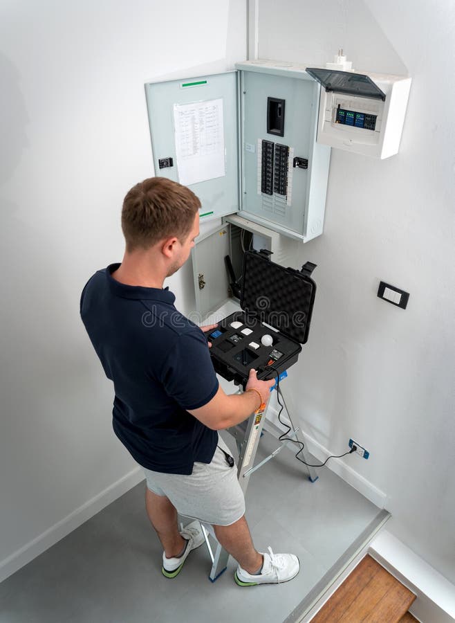 A Technician Works with a Demo Kit of the Smart Home System Stock Image ...